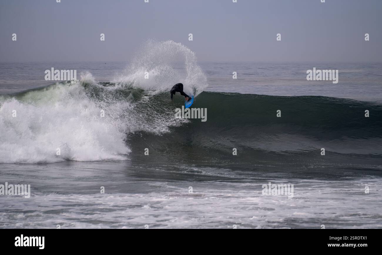 Redondo Beach, CA - USA - December 23, 2024 : Surfers take on unusually ...