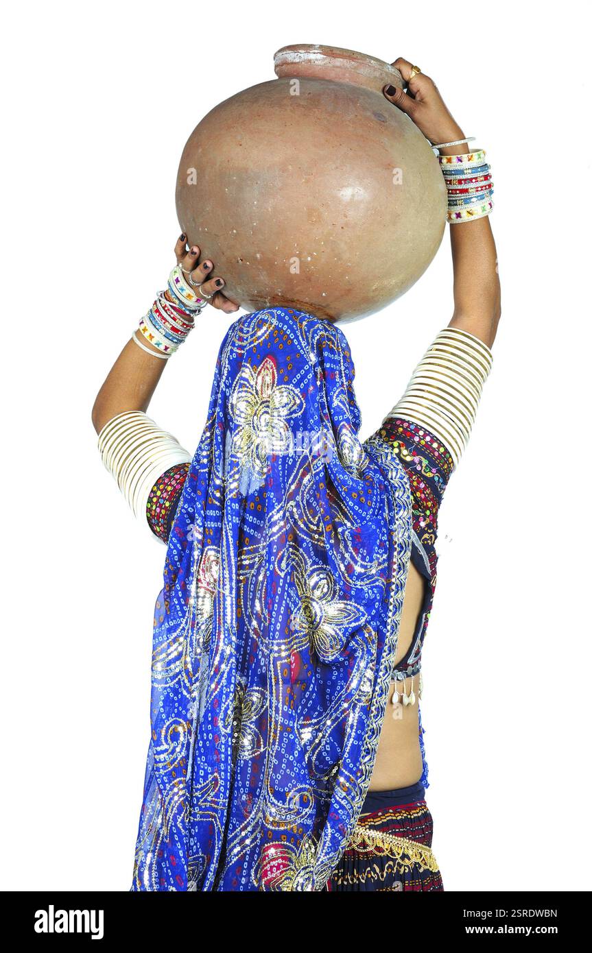 Rajasthani lady carrying earthen pitcher on head MR#786 Stock Photo - Alamy