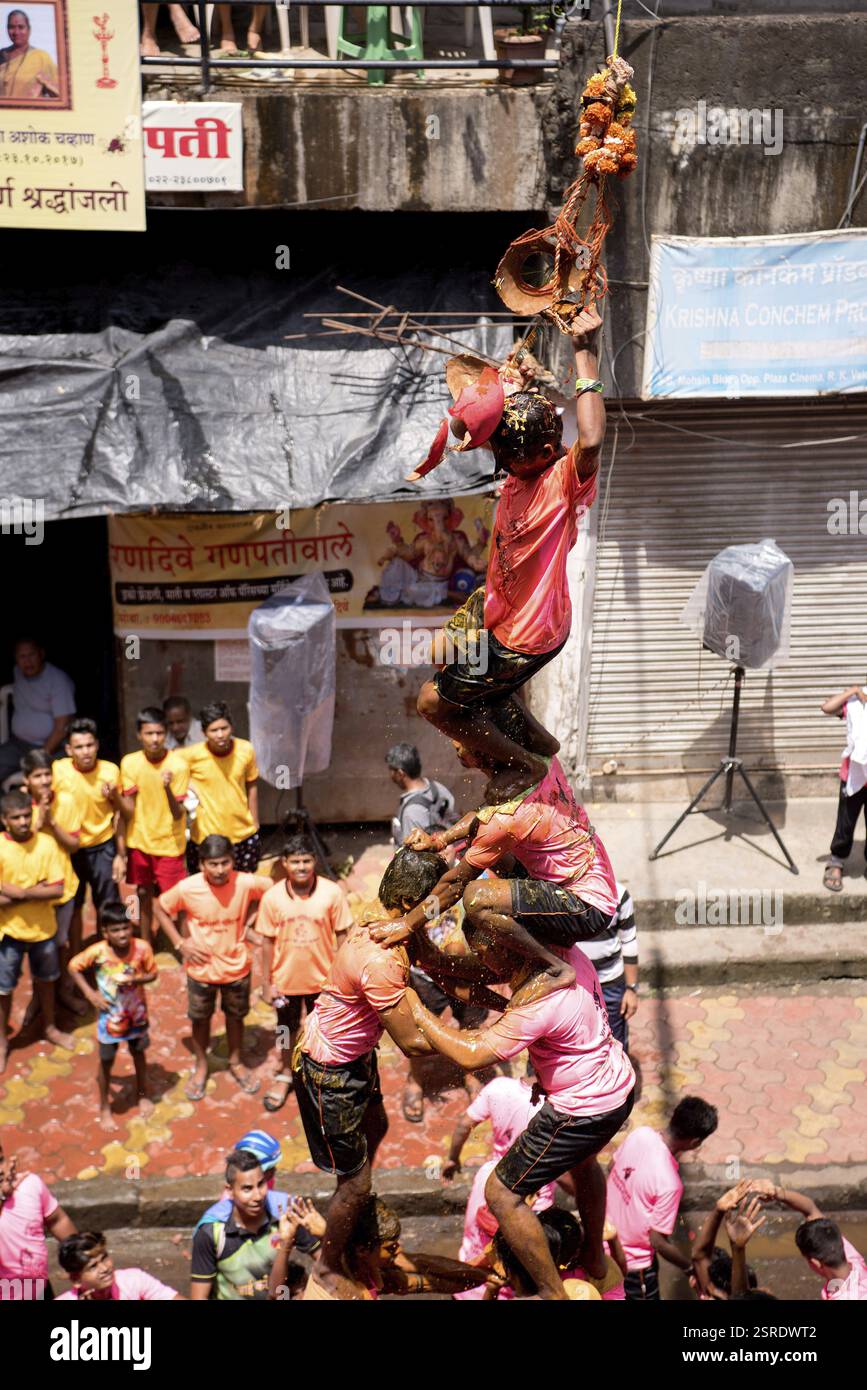 Men human pyramid breaking Dahi Handi, Janmashtami festival, Mumbai ...