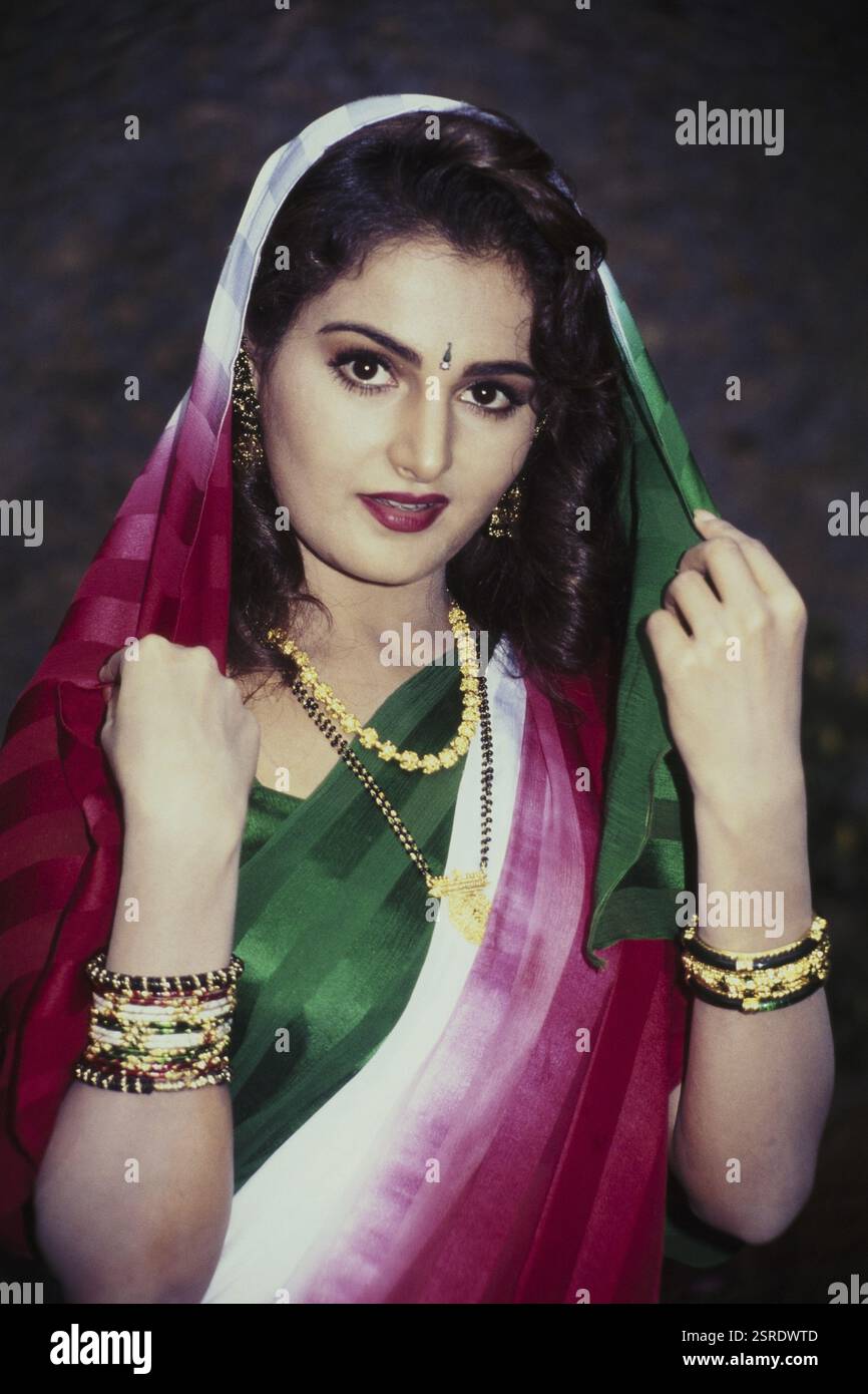Portrait of Monika Bedi holding sari, India, Asia Stock Photo - Alamy