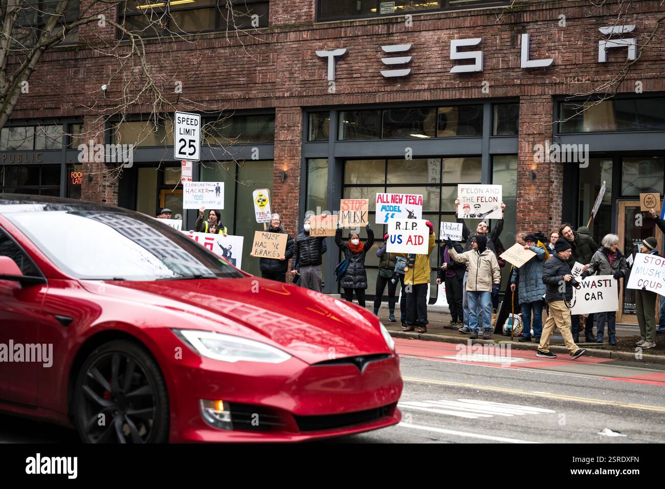 Seattle, USA. 15th Feb 2025. Activists gather during the Tesla Takeover ...