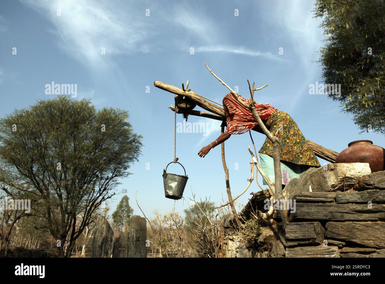 Rajasthani lady fetch drinking water from well, Rajasthan, India, Asia ...