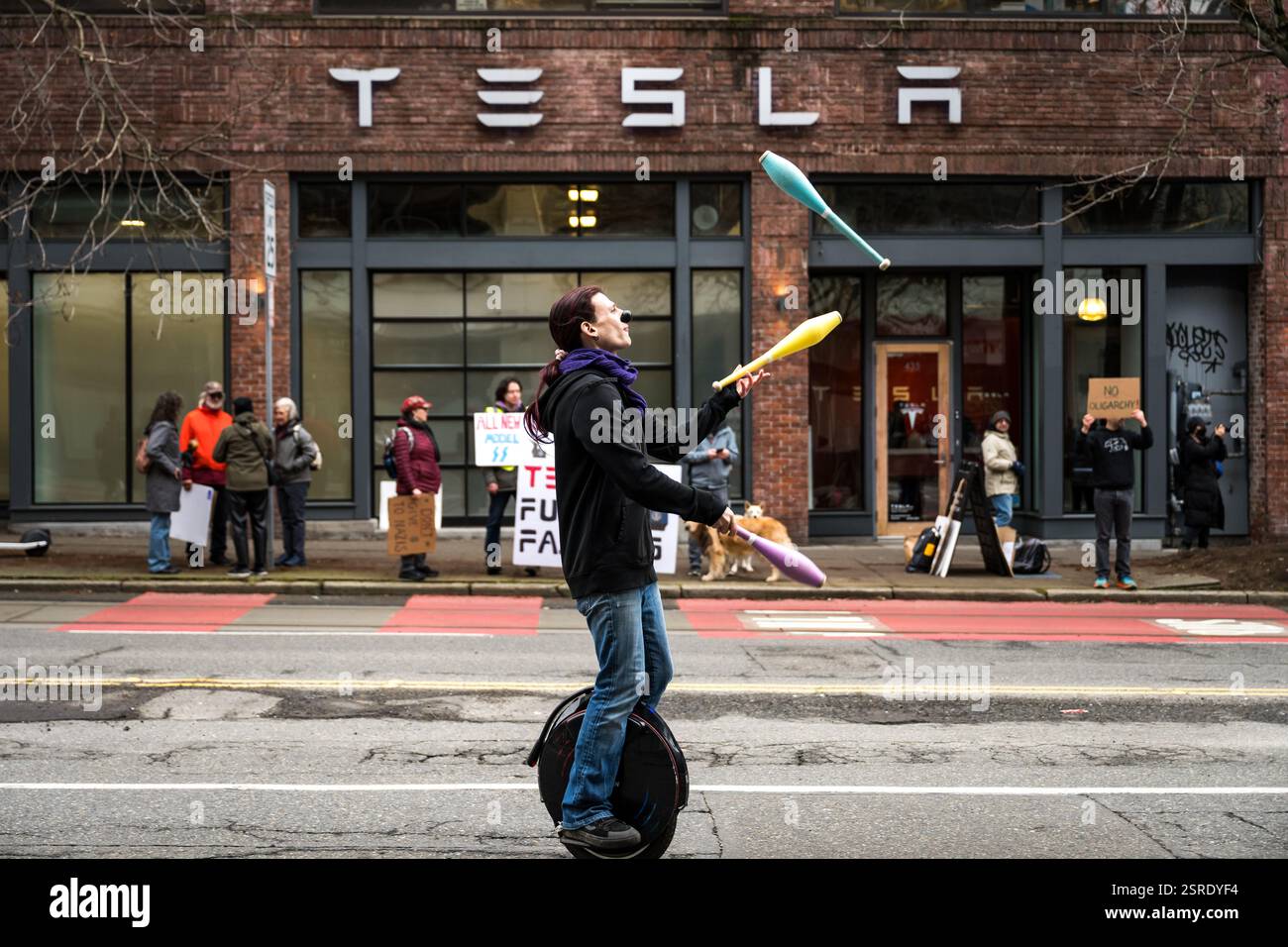 Seattle, USA. 15th Feb 2025. Activists gather during the Tesla Takeover ...