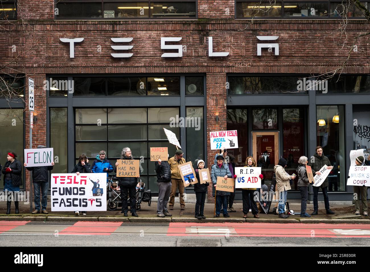 Seattle, USA. 15th Feb 2025. Activists gather during the Tesla Takeover ...