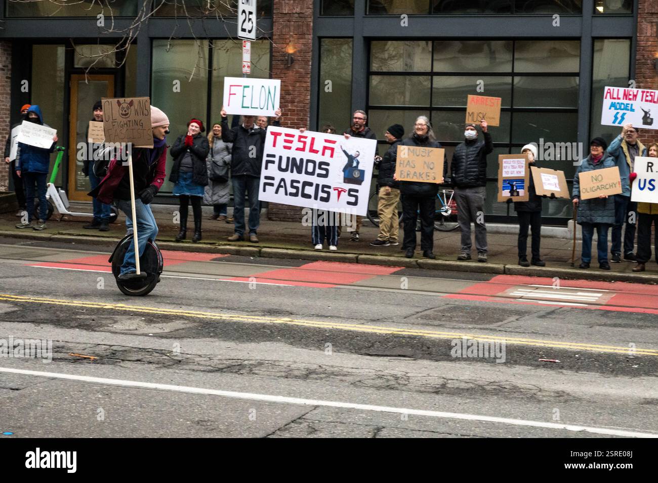 Seattle, USA. 15th Feb 2025. Activists gather during the Tesla Takeover ...