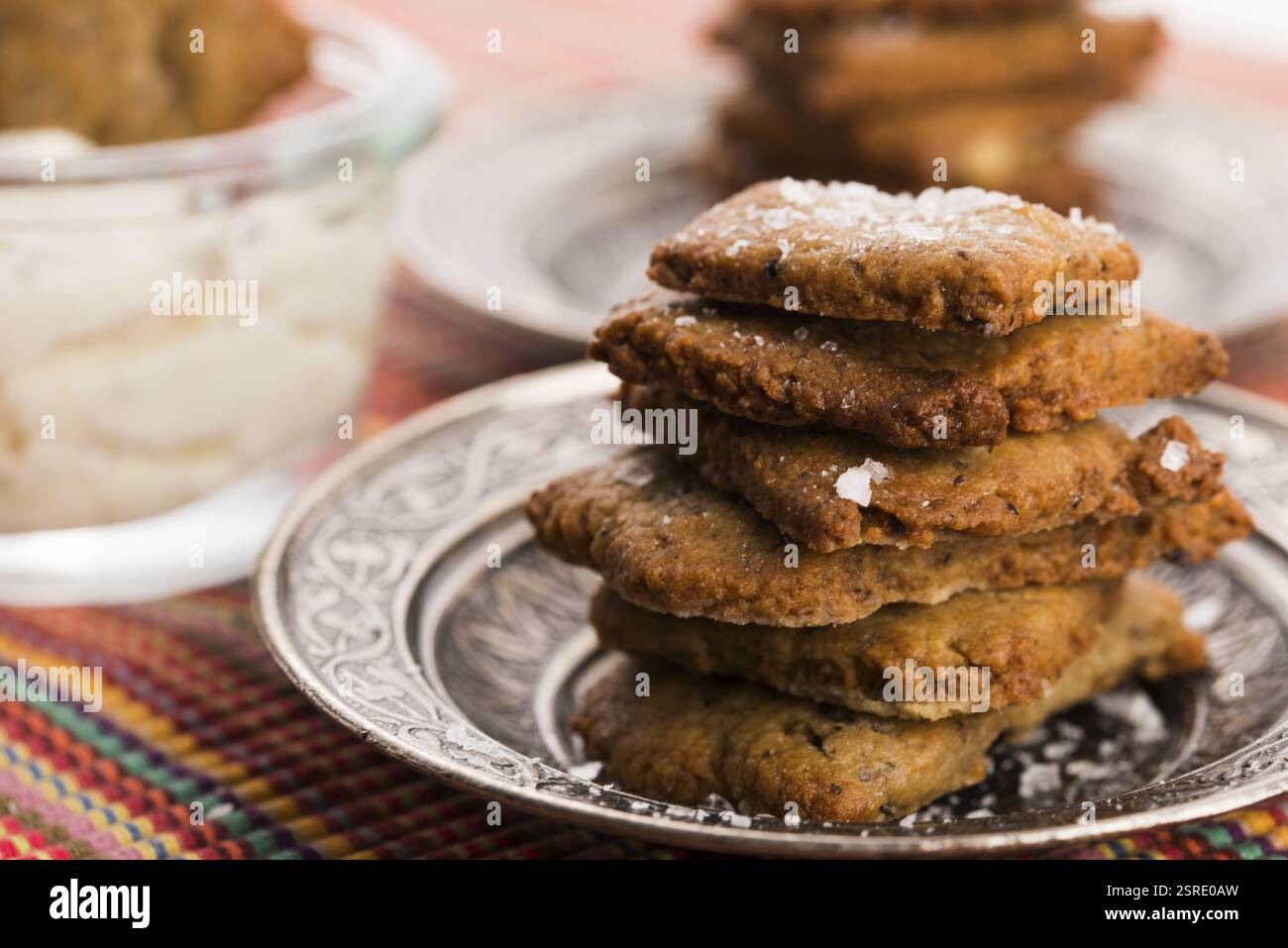 Spanish snack crackers with black olives and anchois Stock Photo - Alamy
