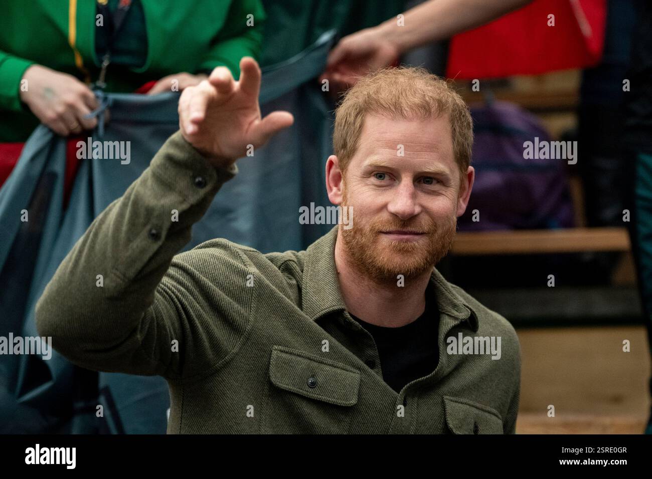 Prince Harry, the Duke of Sussex, cheers with Team Lithuania during ...