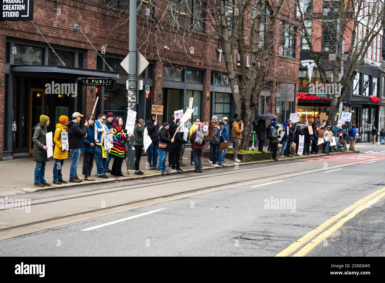 Seattle, USA. 15th Feb 2025. Activists gather during the Tesla Takeover ...