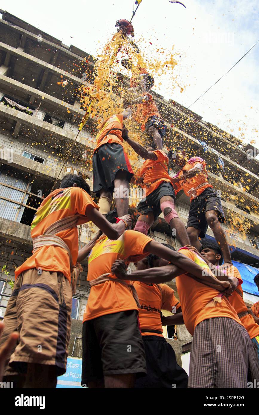 Men human pyramid breaking Dahi Handi, Janmashtami festival, Mumbai ...