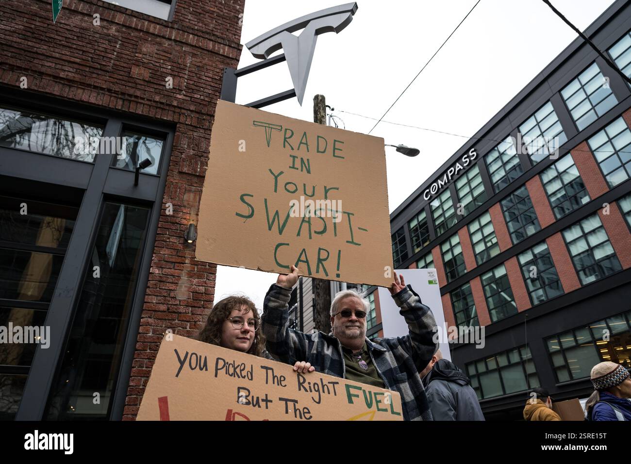 Seattle, USA. 15th Feb 2025. Activists gather during the Tesla Takeover ...