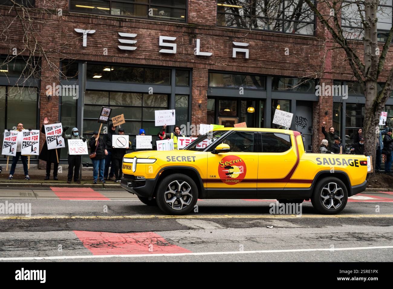 Seattle, USA. 15th Feb 2025. Activists gather during the Tesla Takeover ...