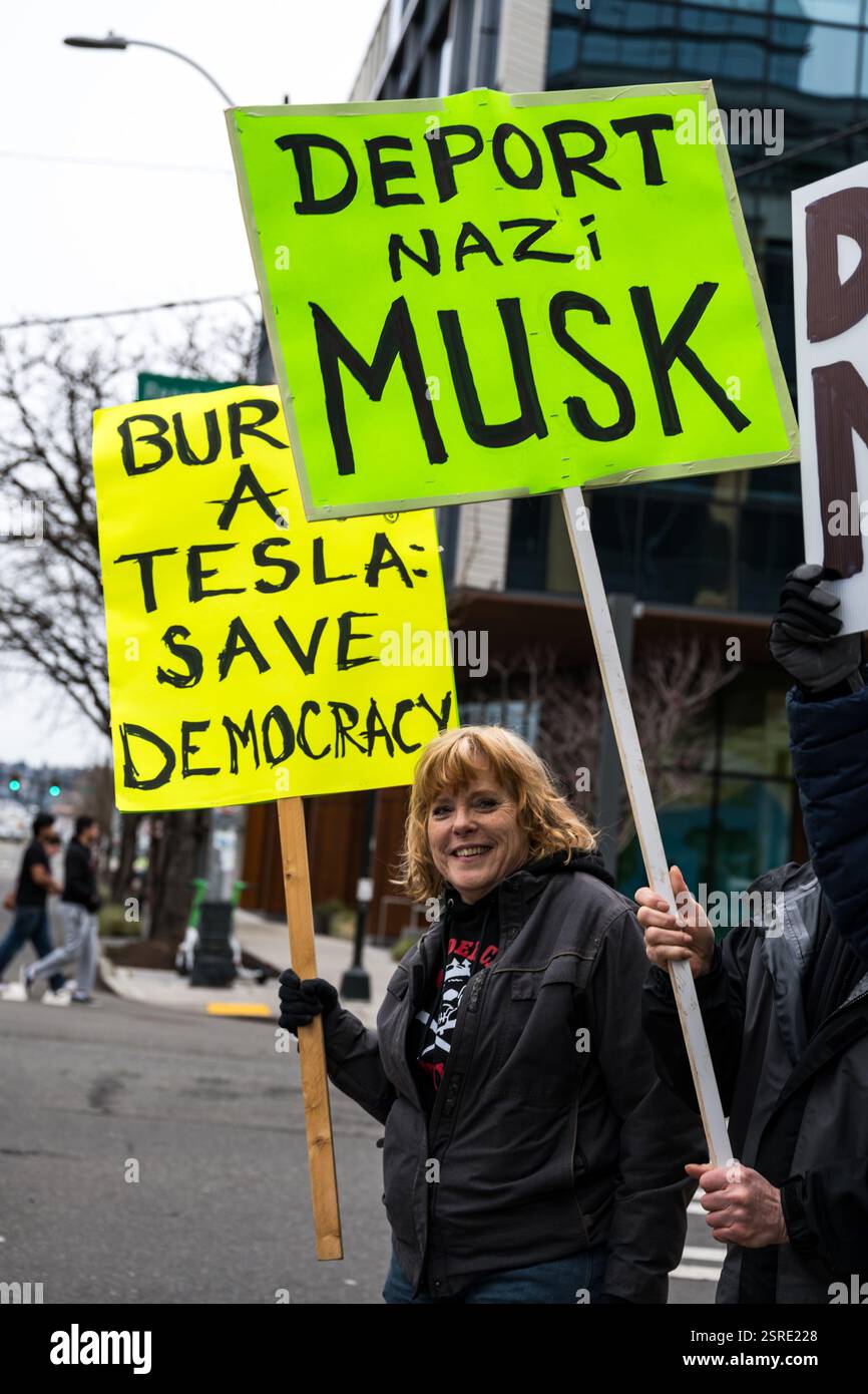 Seattle, USA. 15th Feb 2025. Activists gather during the Tesla Takeover ...