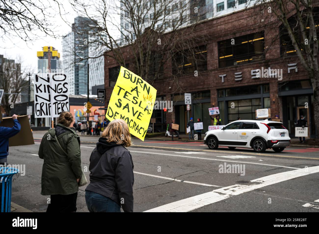 Seattle, USA. 15th Feb 2025. Activists gather during the Tesla Takeover ...