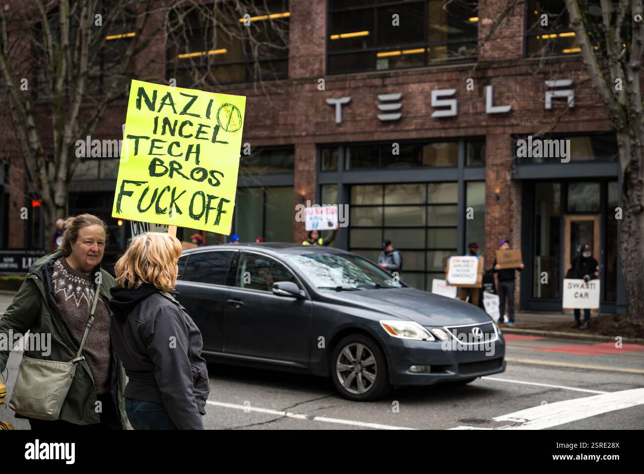 Seattle, USA. 15th Feb 2025. Activists gather during the Tesla Takeover ...