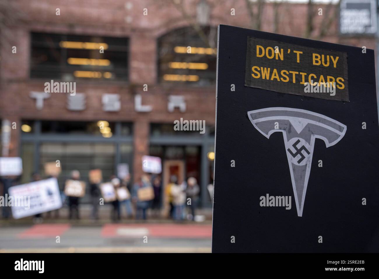 Seattle, Washington, USA. 15th Feb, 2025. People protest against Elon ...