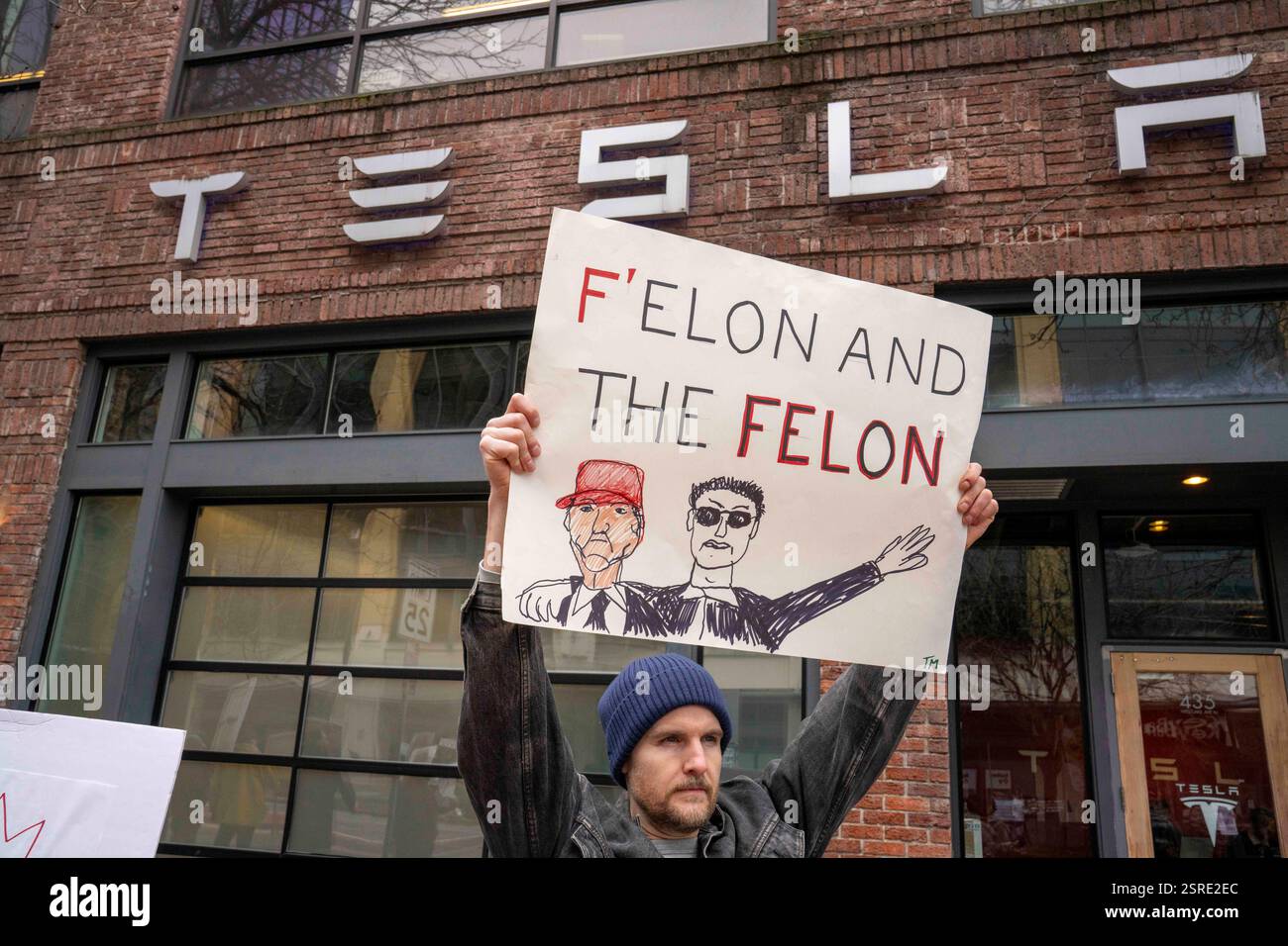 Seattle, Washington, USA. 15th Feb, 2025. People protest against Elon ...