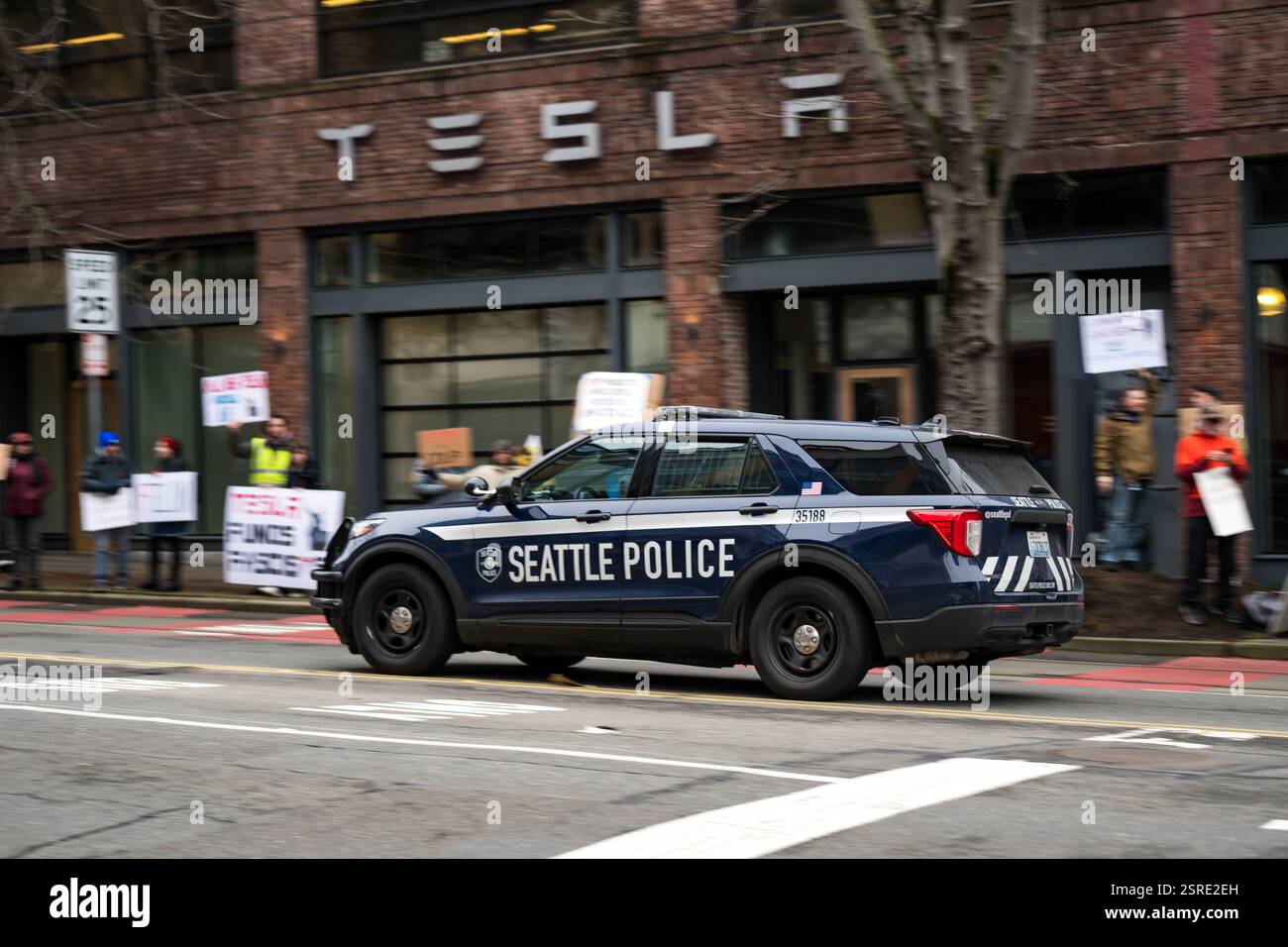 Seattle, USA. 15th Feb 2025. Activists gather during the Tesla Takeover ...