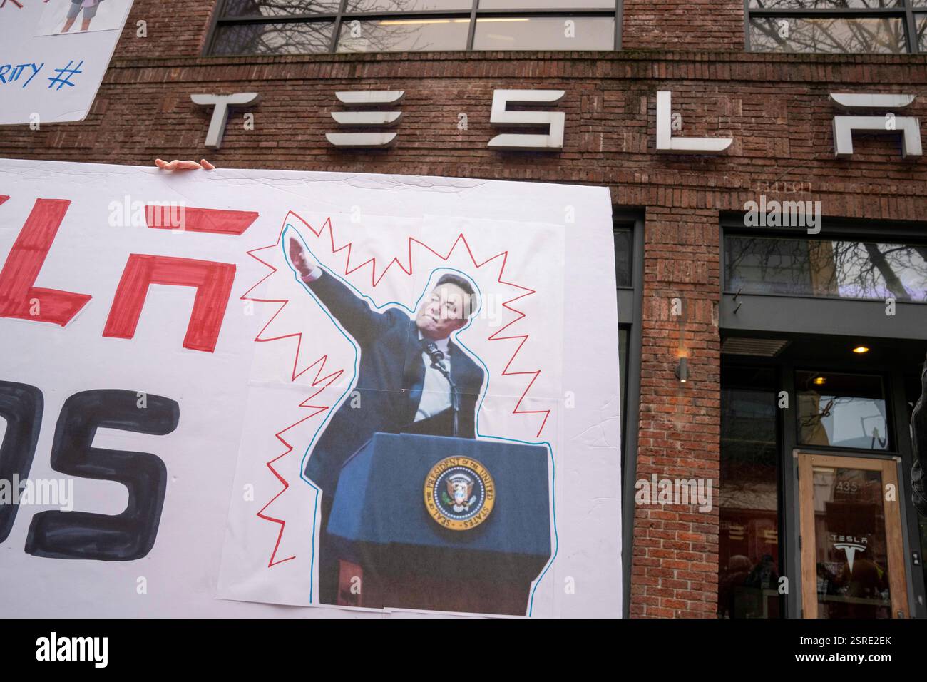 Seattle, Washington, USA. 15th Feb, 2025. People protest against Elon ...