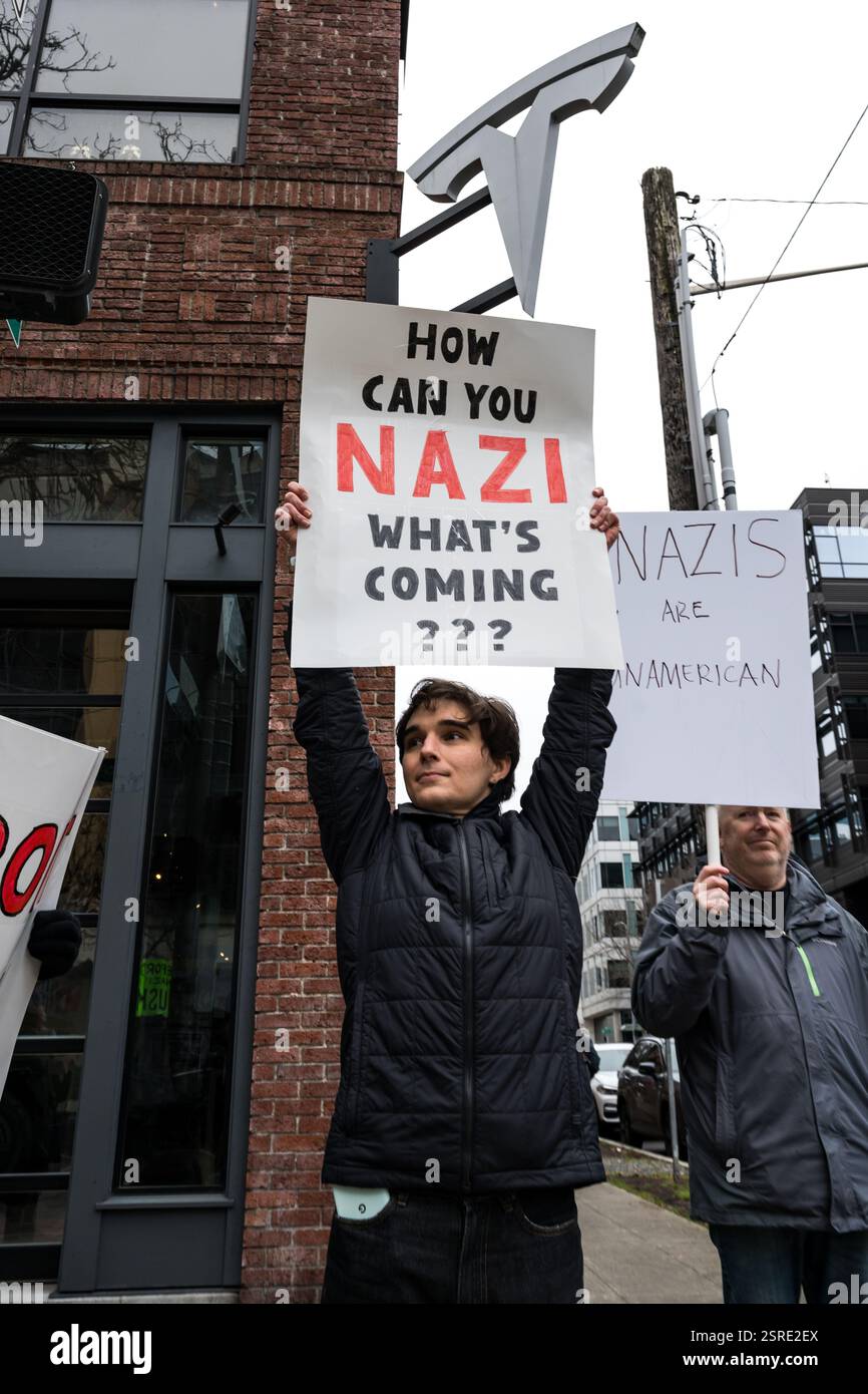 Seattle, USA. 15th Feb 2025. Activists gather during the Tesla Takeover ...