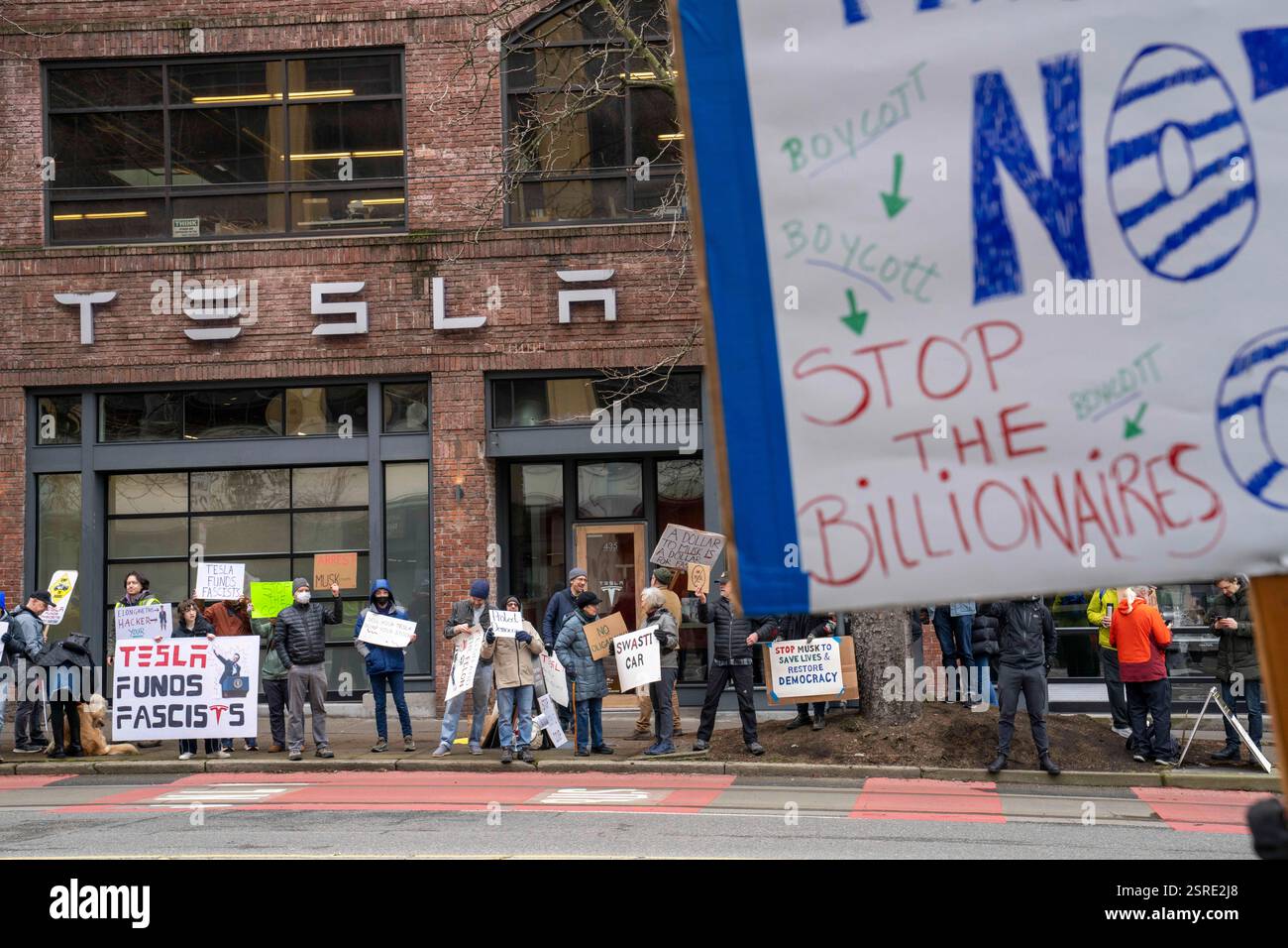 Seattle, Washington, USA. 15th Feb, 2025. People protest against Elon ...