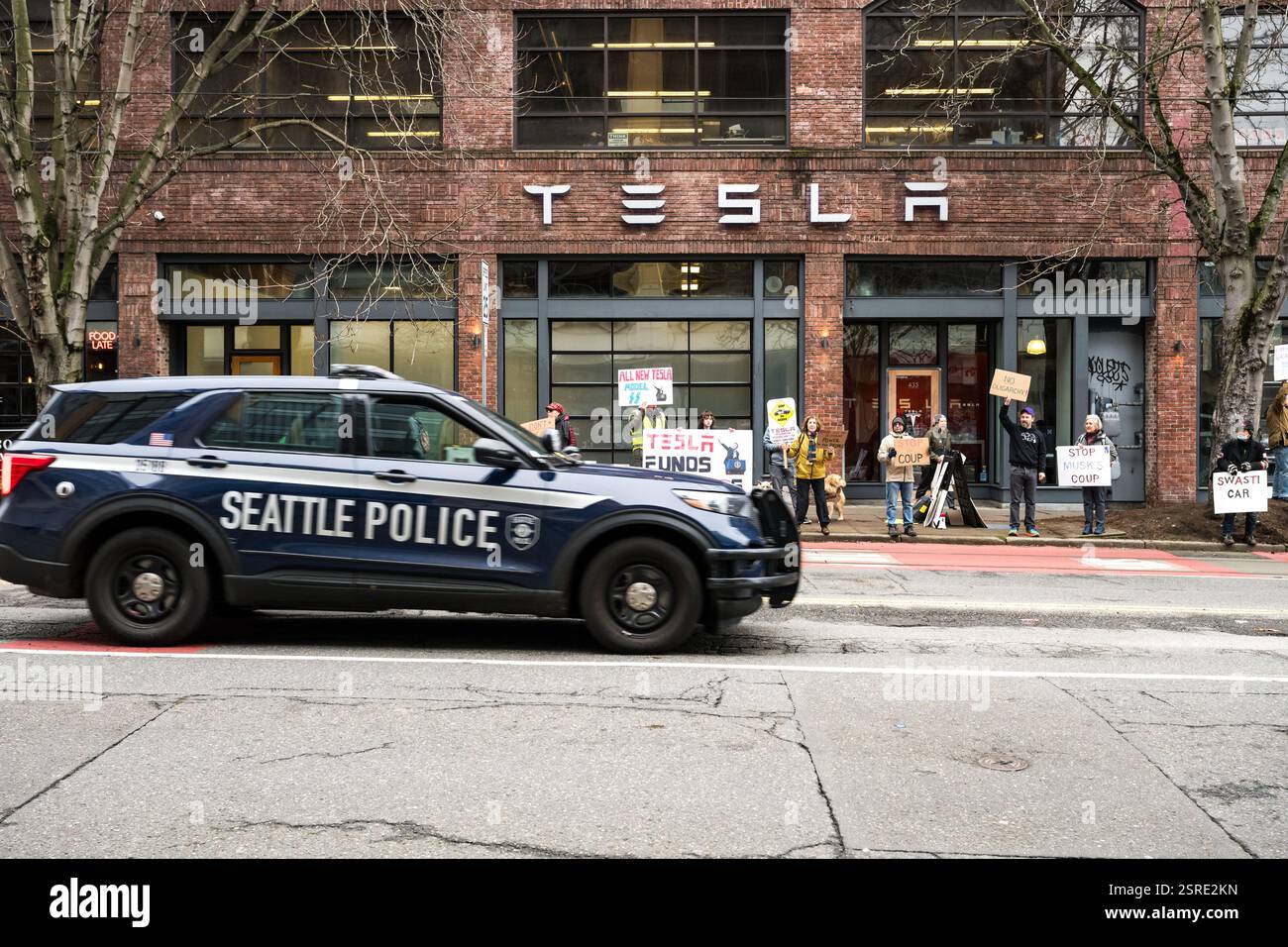 Seattle, USA. 15th Feb 2025. Activists gather during the Tesla Takeover ...