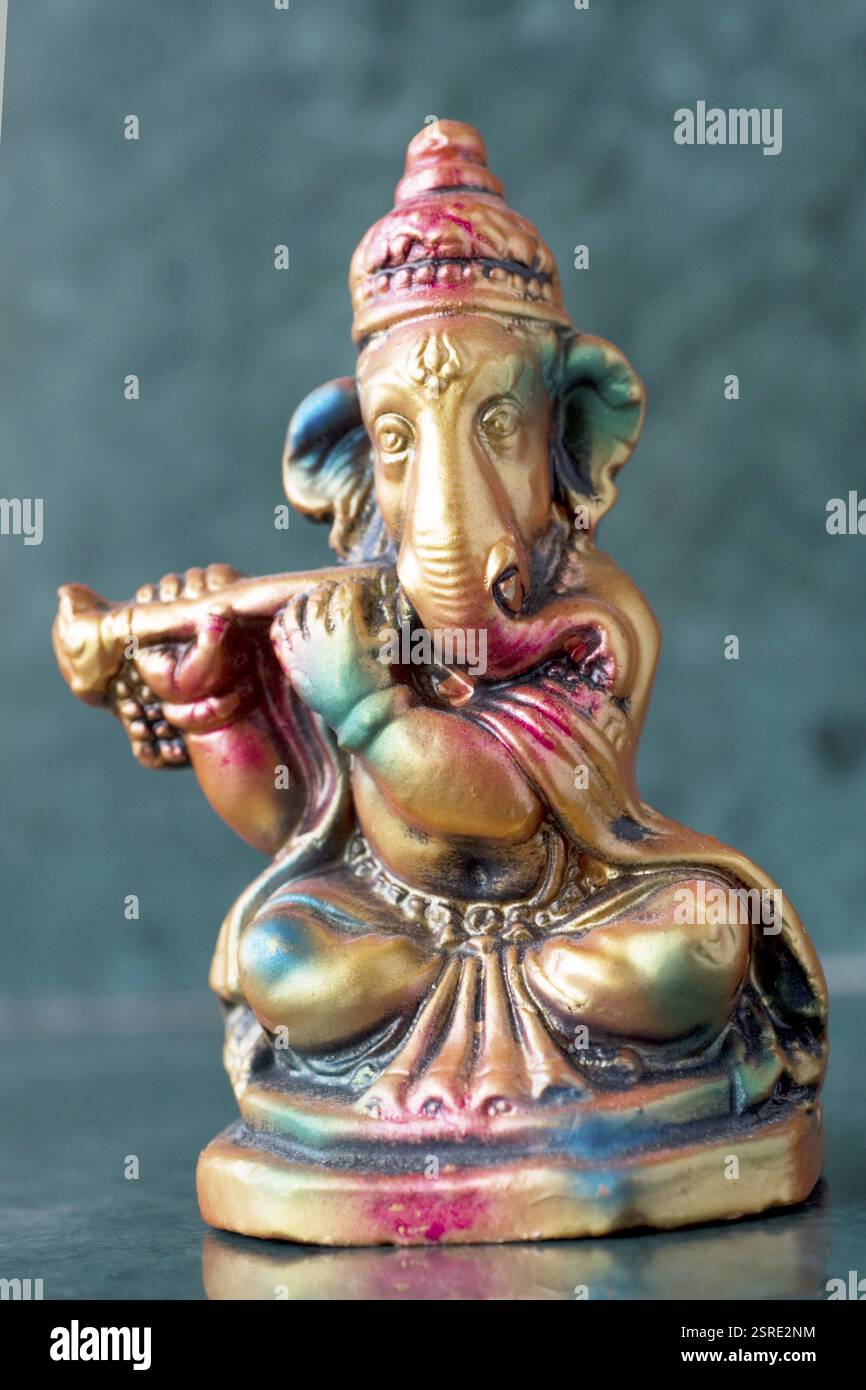 Lord Ganesha ganpati plaster Idol sitting colourful playing shehnai ...
