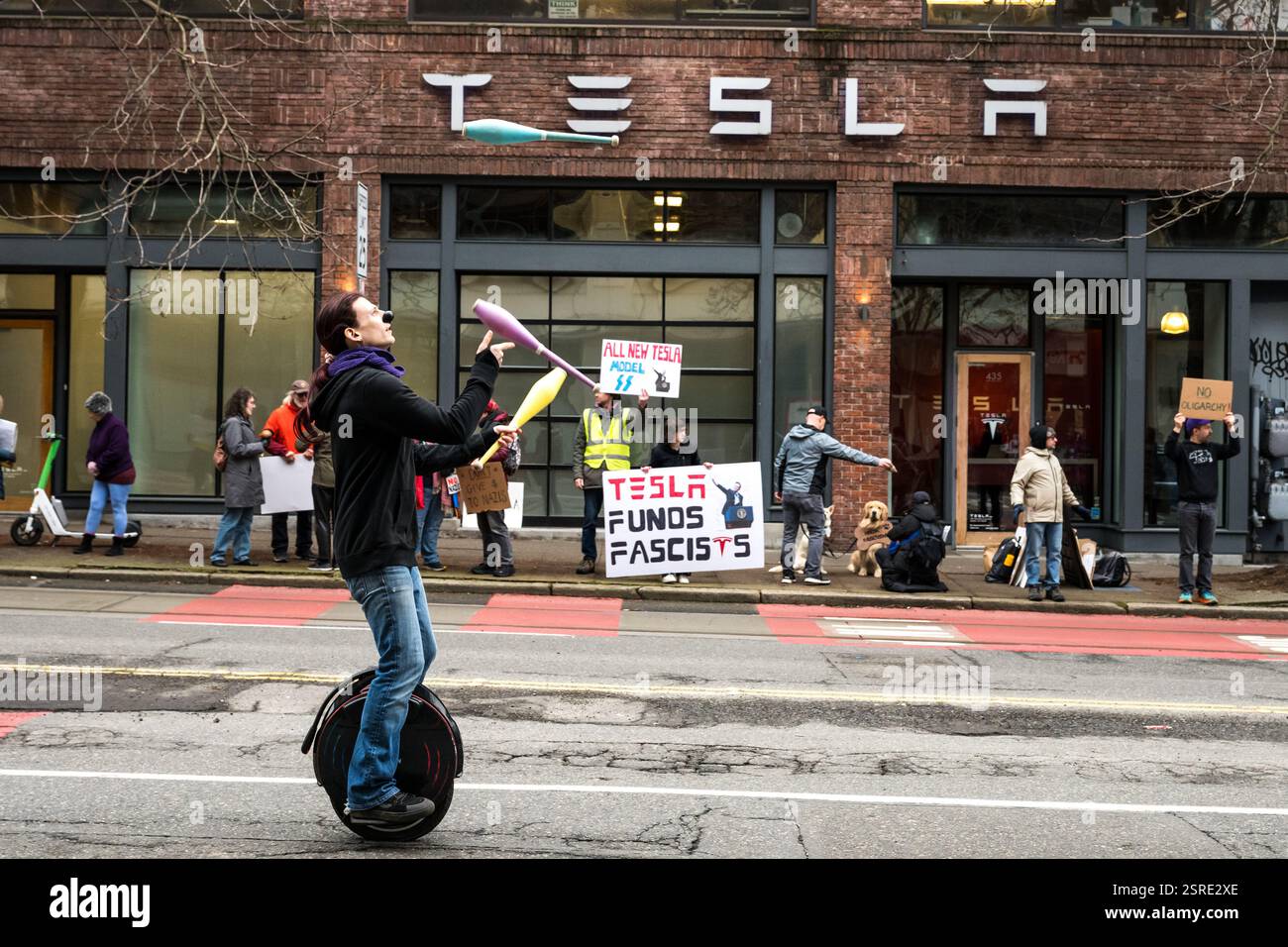 Seattle, USA. 15th Feb 2025. Activists gather during the Tesla Takeover ...