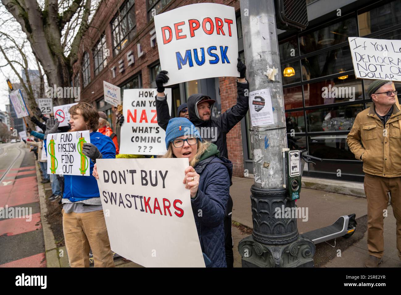 Seattle, Washington, USA. 15th Feb, 2025. People protest against Elon ...