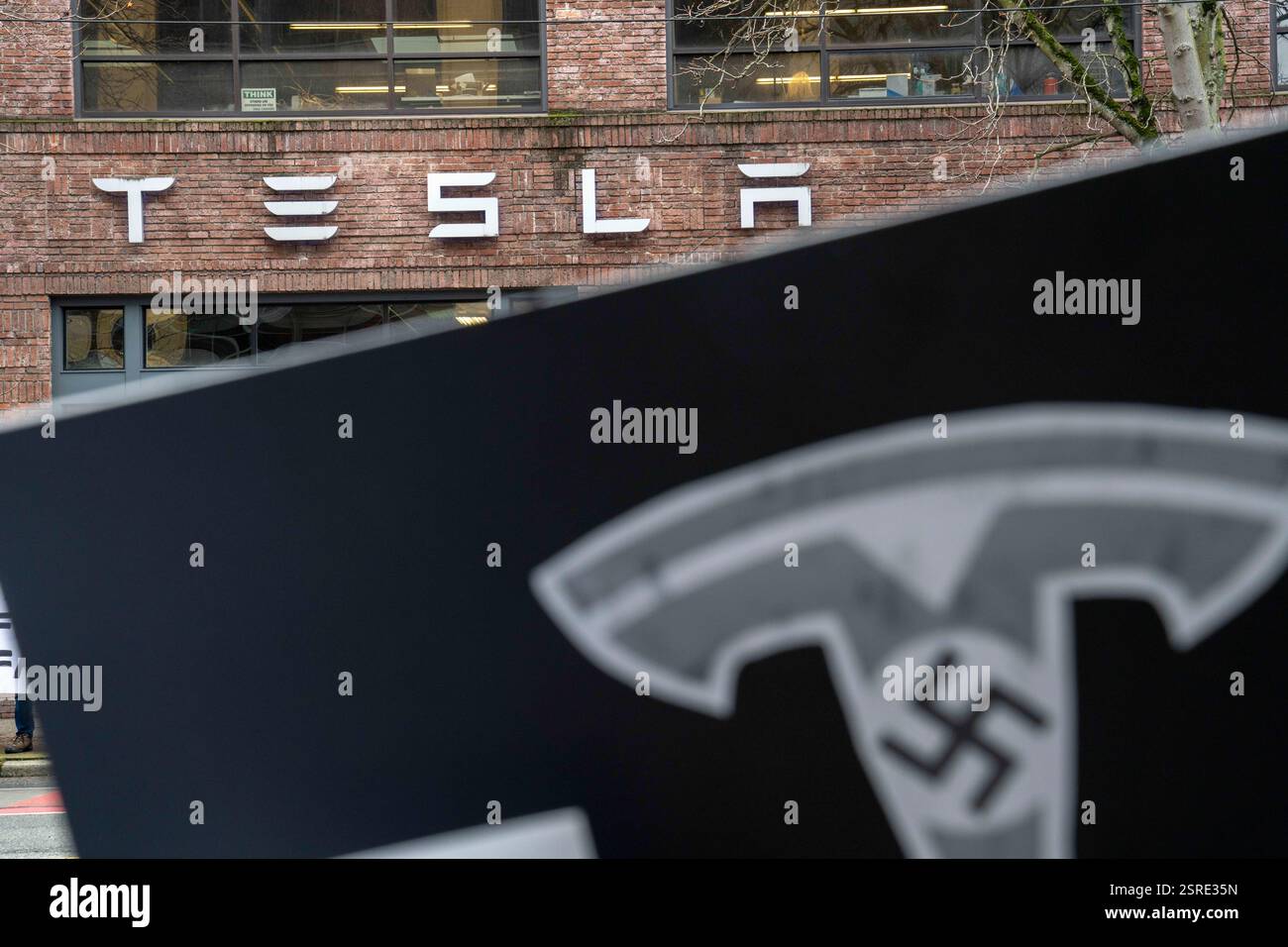 Seattle, Washington, USA. 15th Feb, 2025. People protest against Elon ...