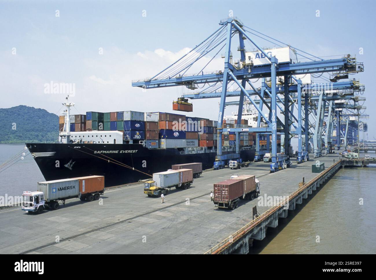 Shipping, containers loading at port, Nhava seva, india Stock Photo - Alamy