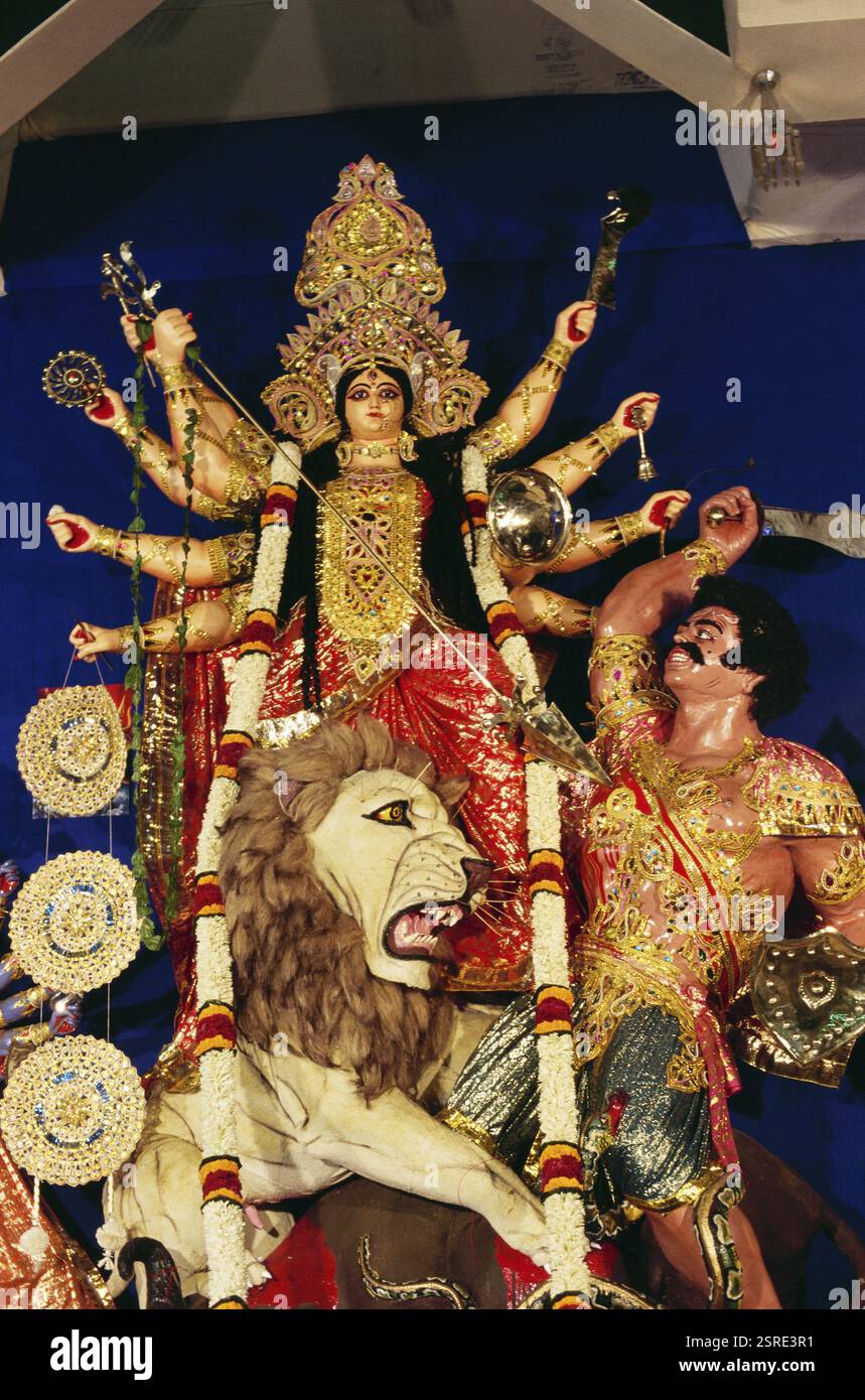 Durga Puja festival, goddess idol mounted on lion killing demon ...