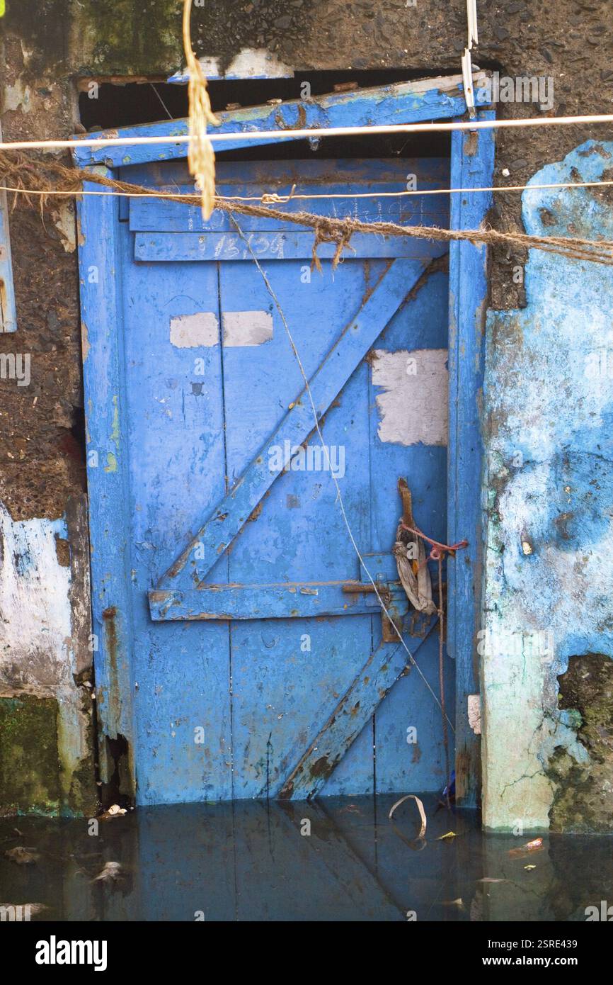 Submerged door in monsoon water in malvani slum, Malad, Bombay Mumbai ...