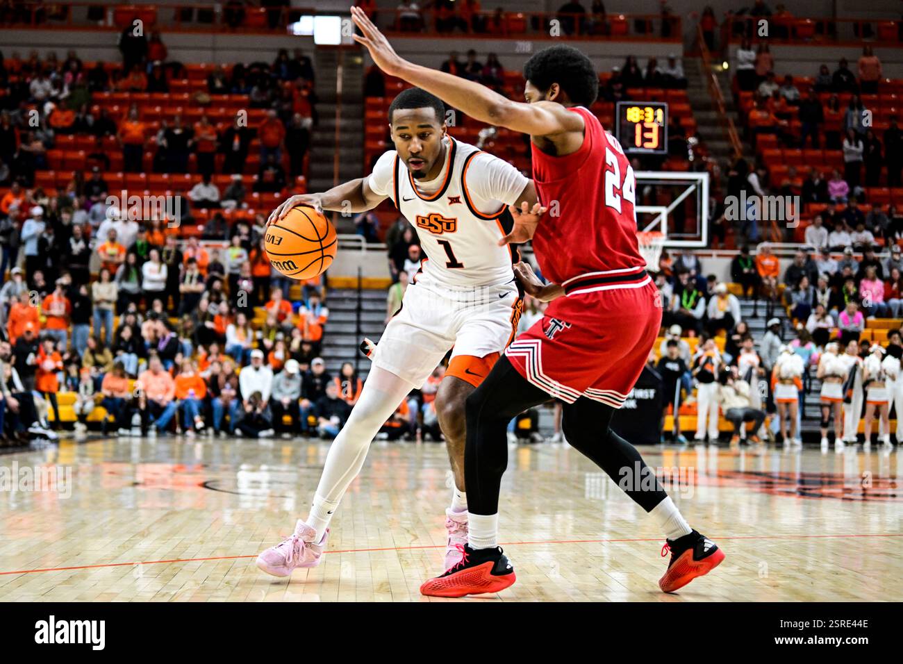 Oklahoma State guard Bryce Thompson (1) drives against Texas Tech guard ...