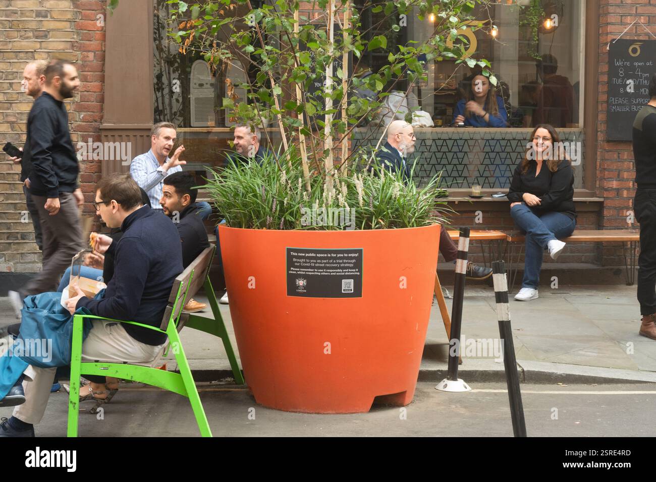 People enjoy a new public space, part of a COVID-19 recovery strategy ...