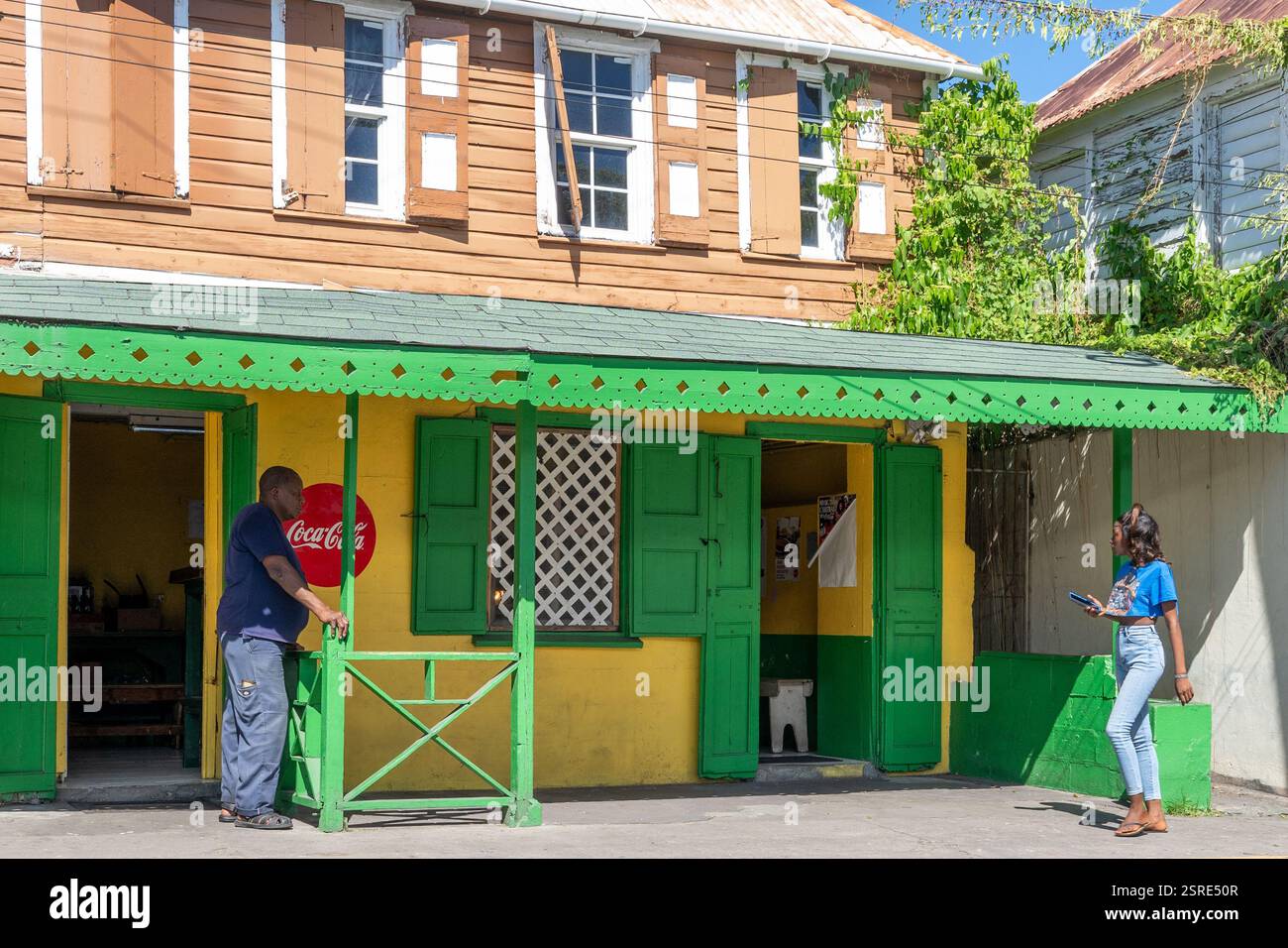 Man Watches A Passer-By At A Traditional Local No-Frills Cafe With ...