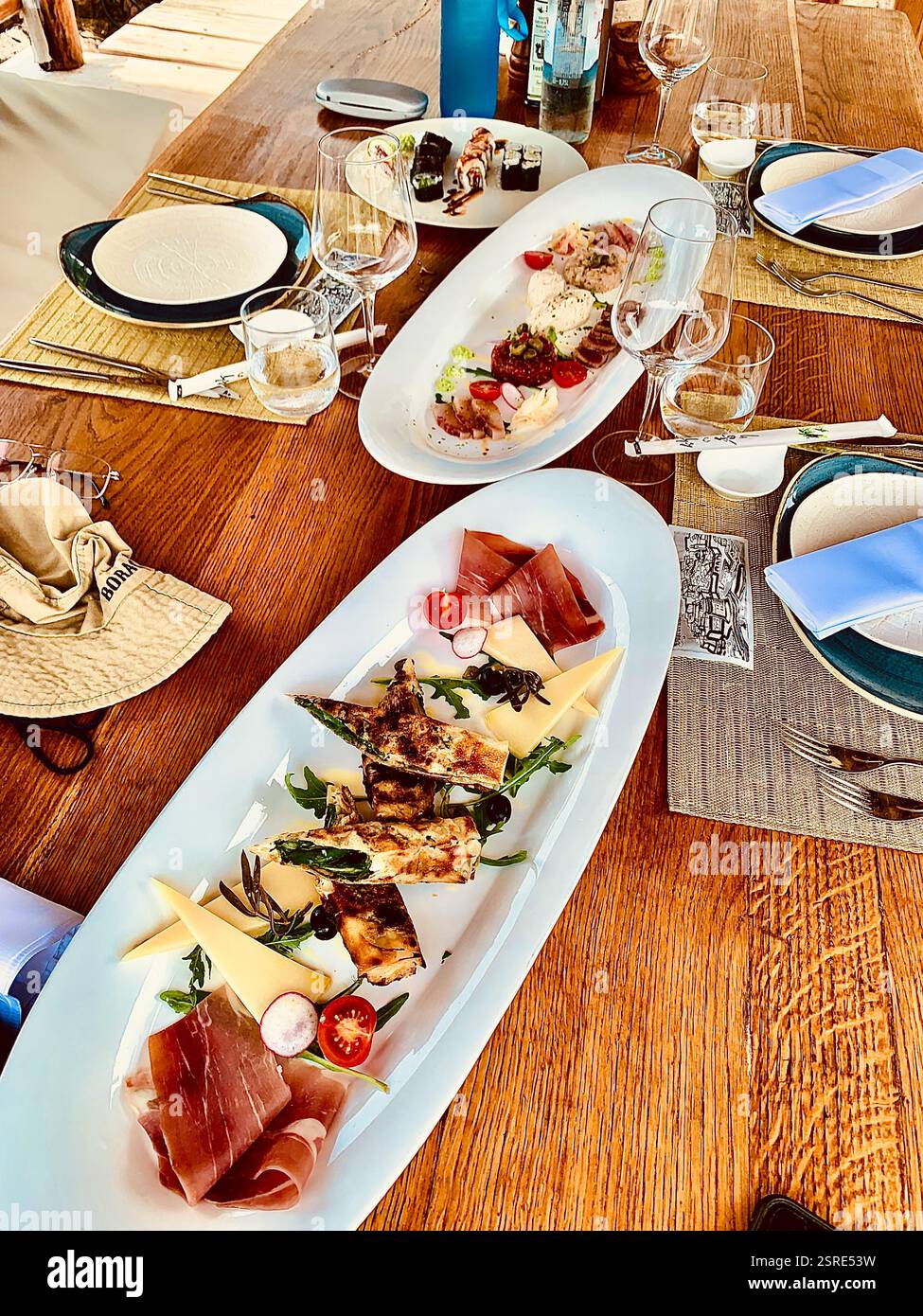 Plates of mixed starters a luxury island setting Stock Photo - Alamy