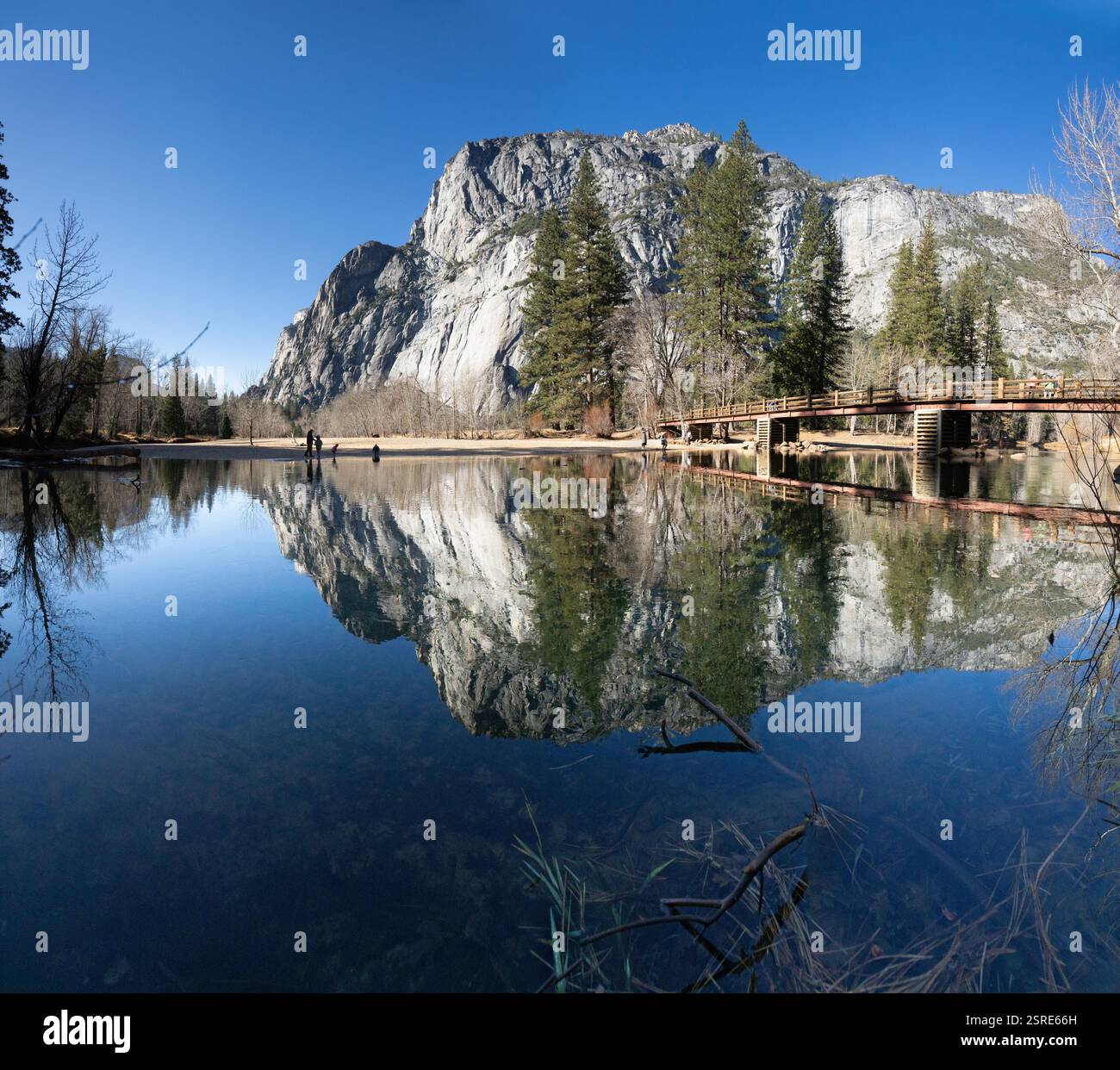 Hikers on the Merced River Bridge, Yosemite National Park. Reflections ...