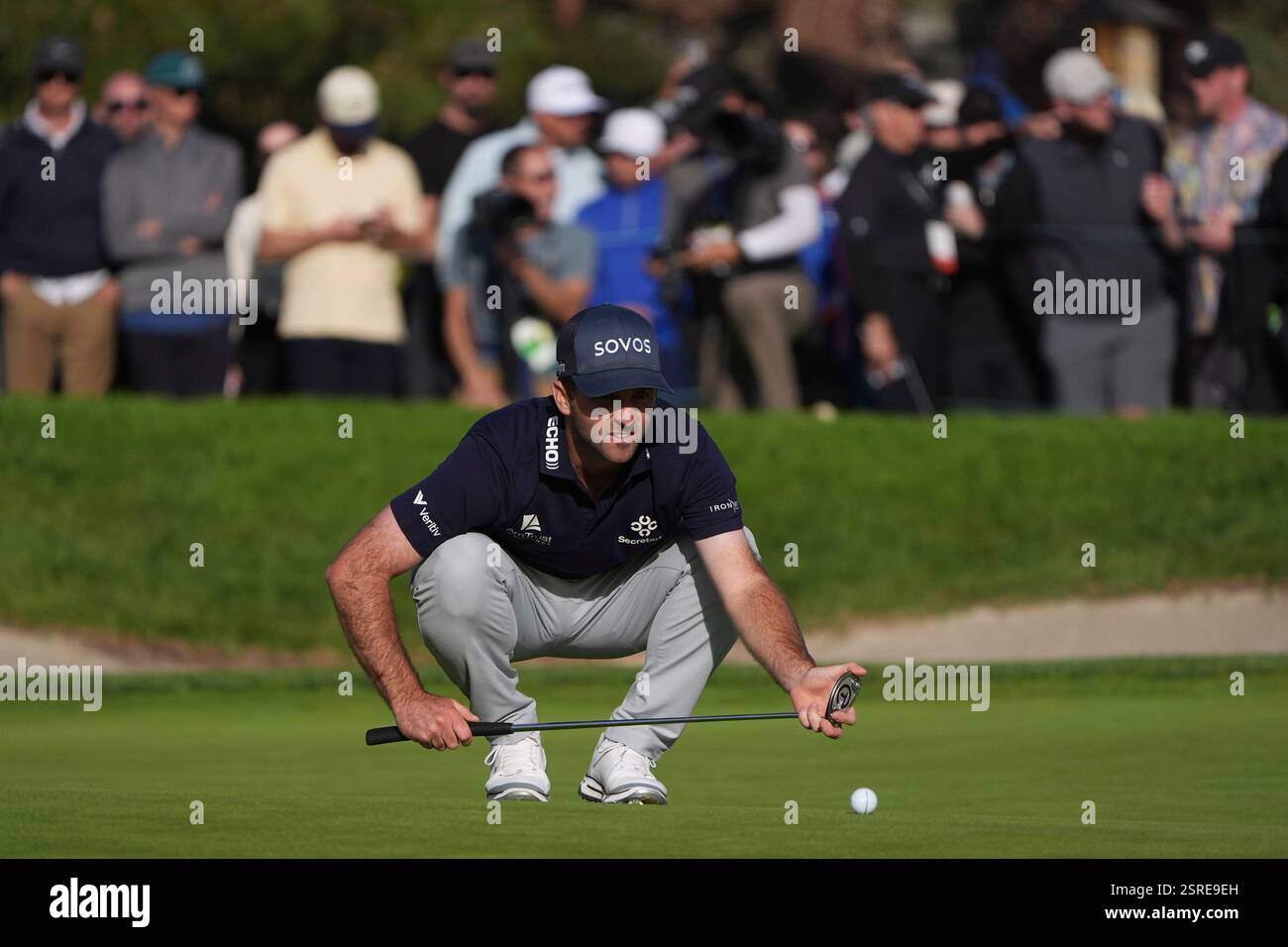 Denny McCarthy lines up a putt on the 18th green of the South Course at ...