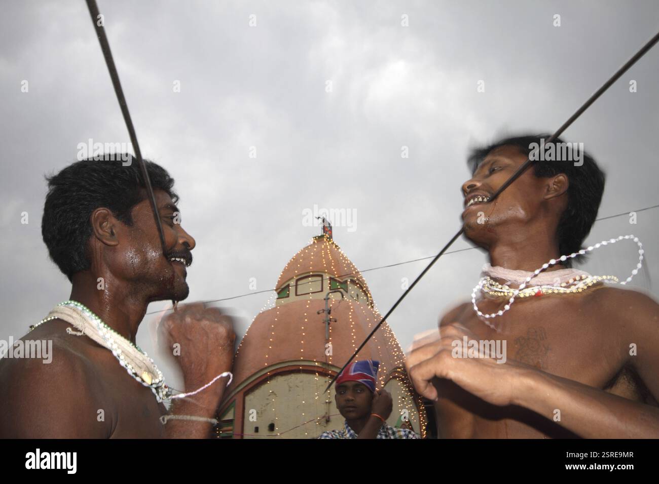 Man piercing, gajan festival, west bengal, india, asia Stock Photo - Alamy