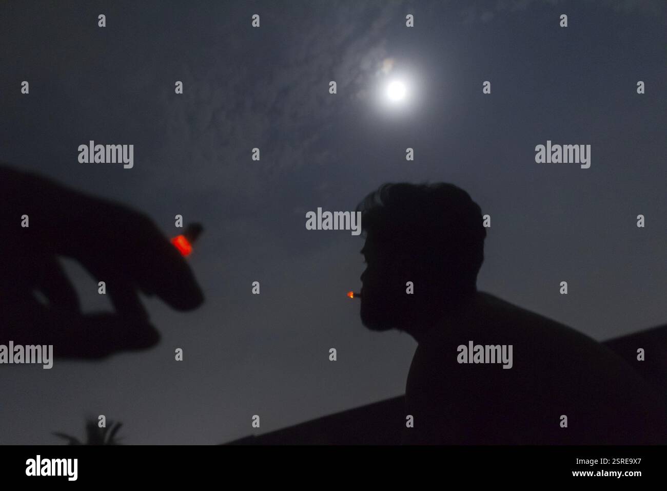 Men smoking at night, Barasat, Kolkata, West Bengal, India, Asia Stock ...