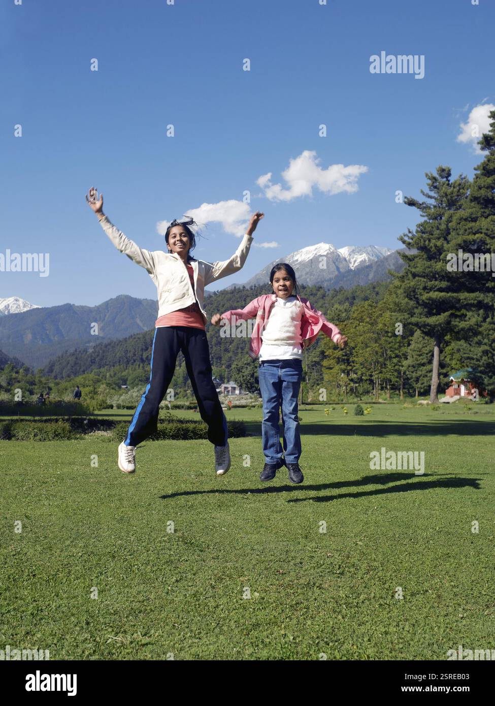Girls jumping with joy in indira gandhi park, Pahalgam, Jammu and ...