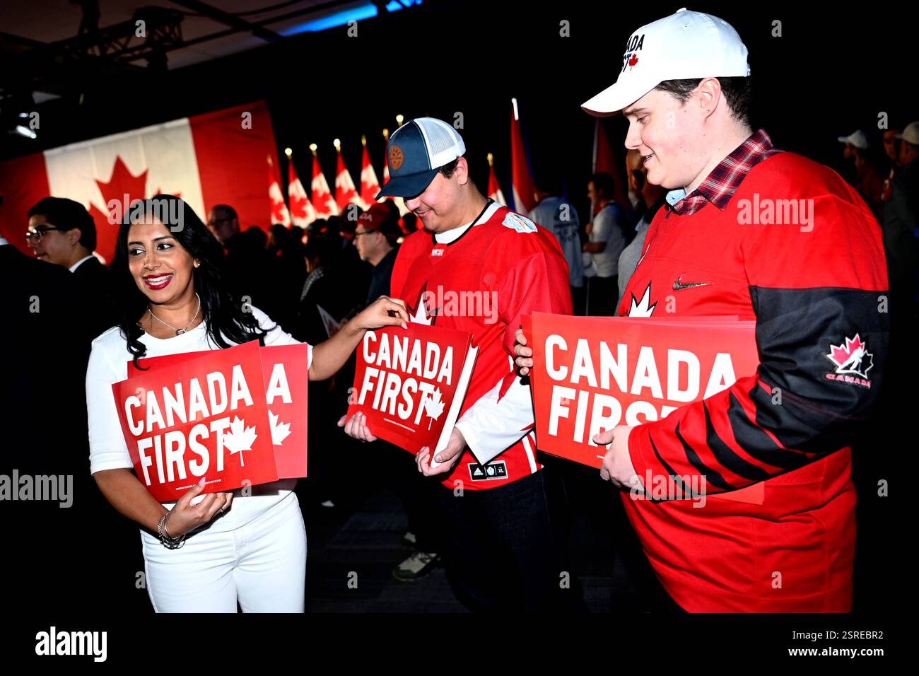 Ottawa, Can. 15th Feb, 2025. A supporter gets a sign before ...