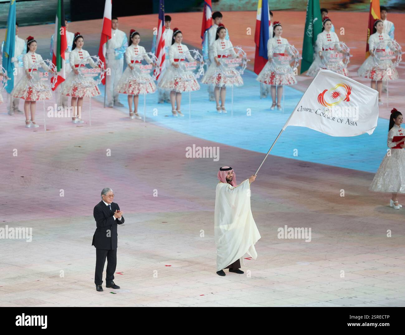 The Saudi Arabia delegate waves the OCA flag delegate during the ...