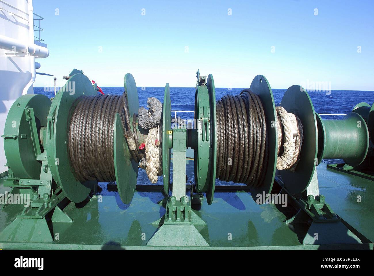 Mooring winch in merchant vessel for mooring and unmooring Stock Photo ...