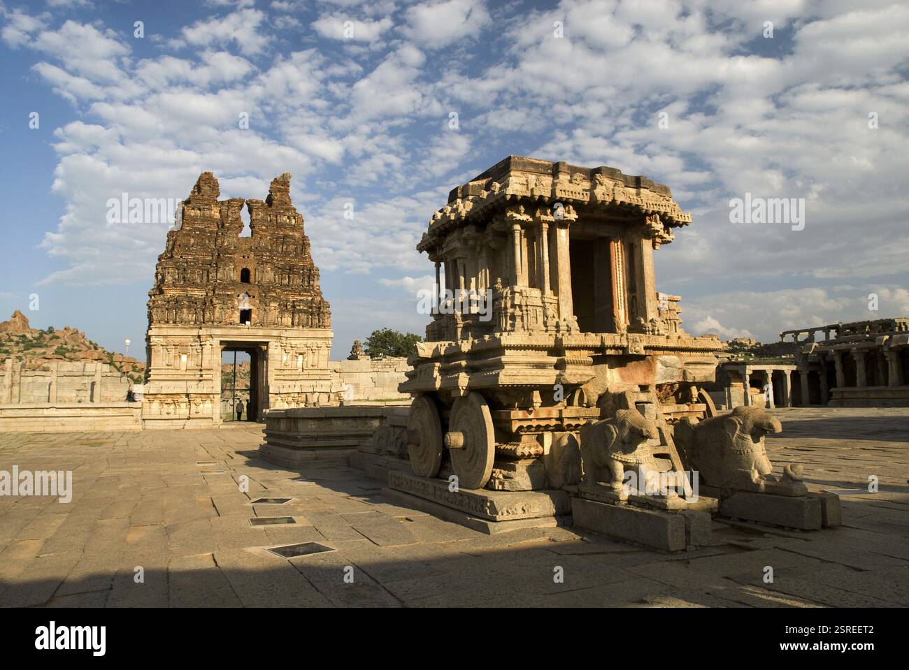 Stone chariot and Vijayavittala temple tower in Hampi, Karnataka, India ...