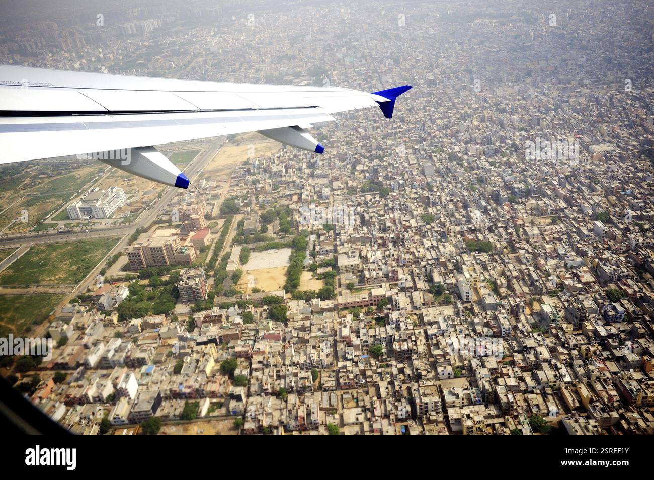 Aerial view of city and aircraft wing, Delhi, India, Asia Stock Photo ...