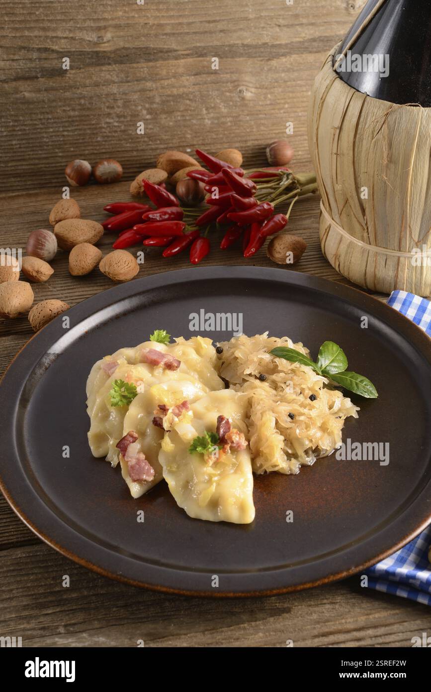 Pierogi.Polish dish pierogi with sauerkraut and mushrooms Stock Photo ...