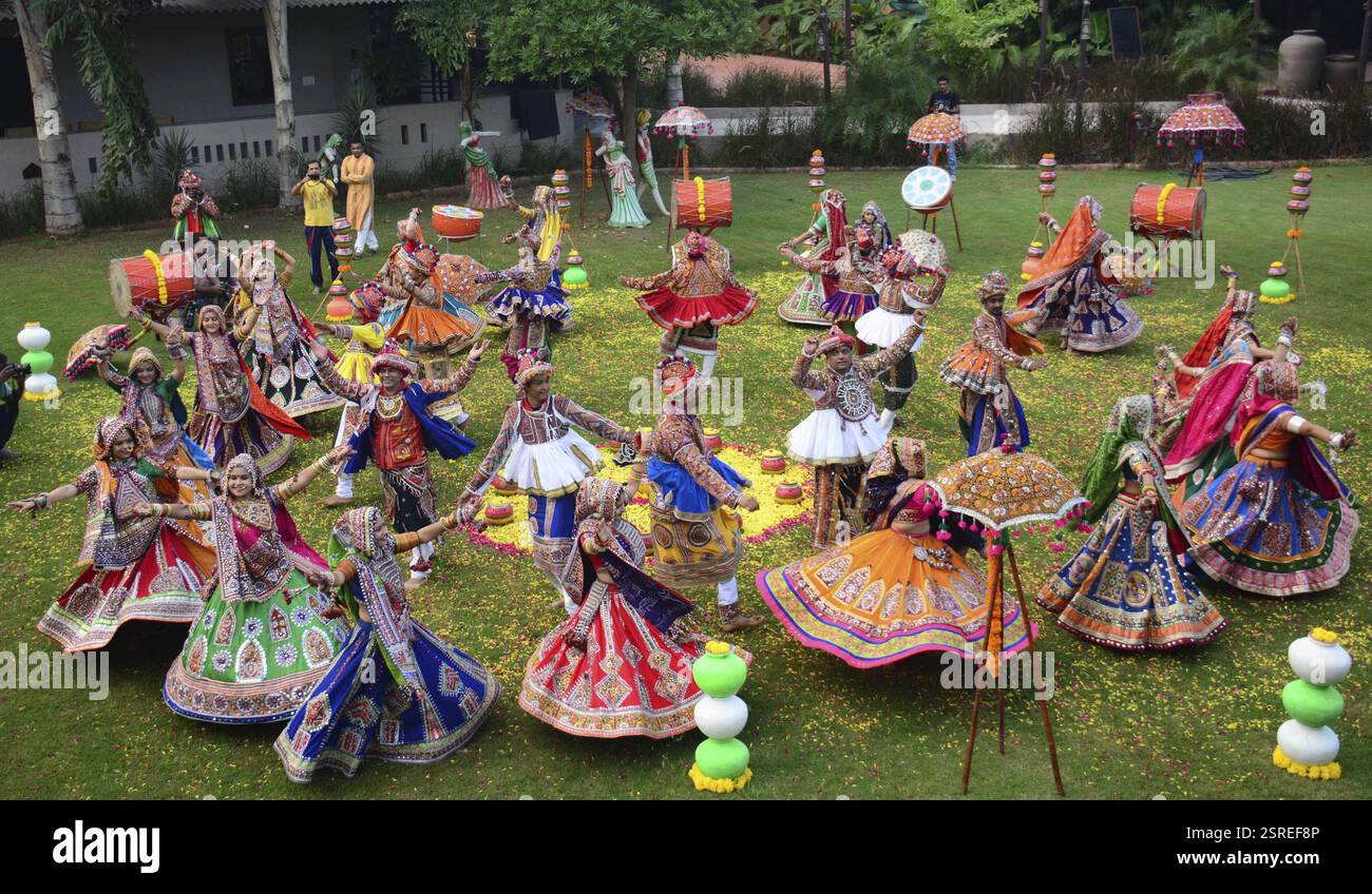 Girls in traditional attire, practice the Garba dance steps in ...