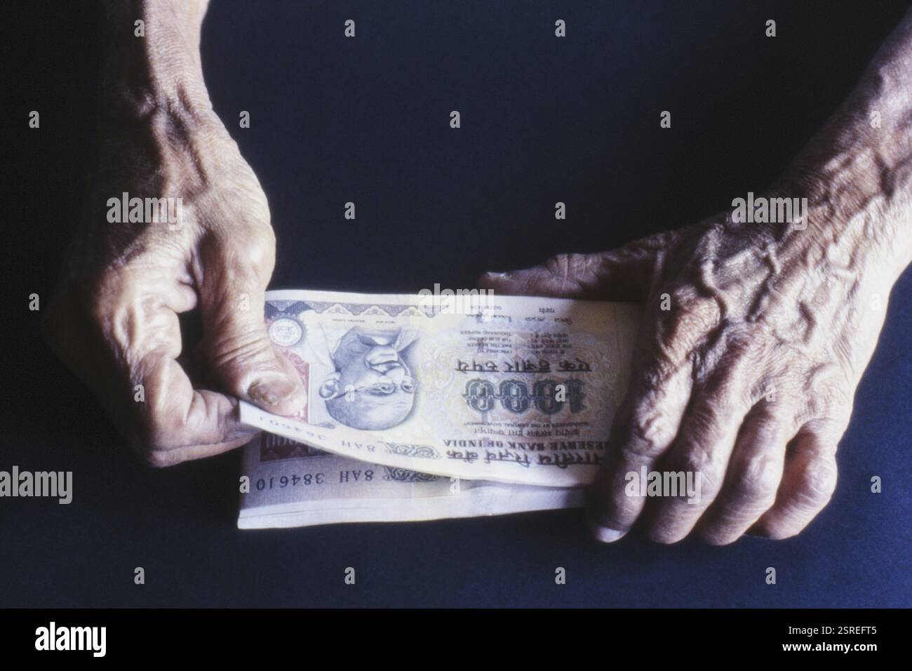 Old man counting paper money 1000 rupees, Mumbai, India, Asia Stock ...