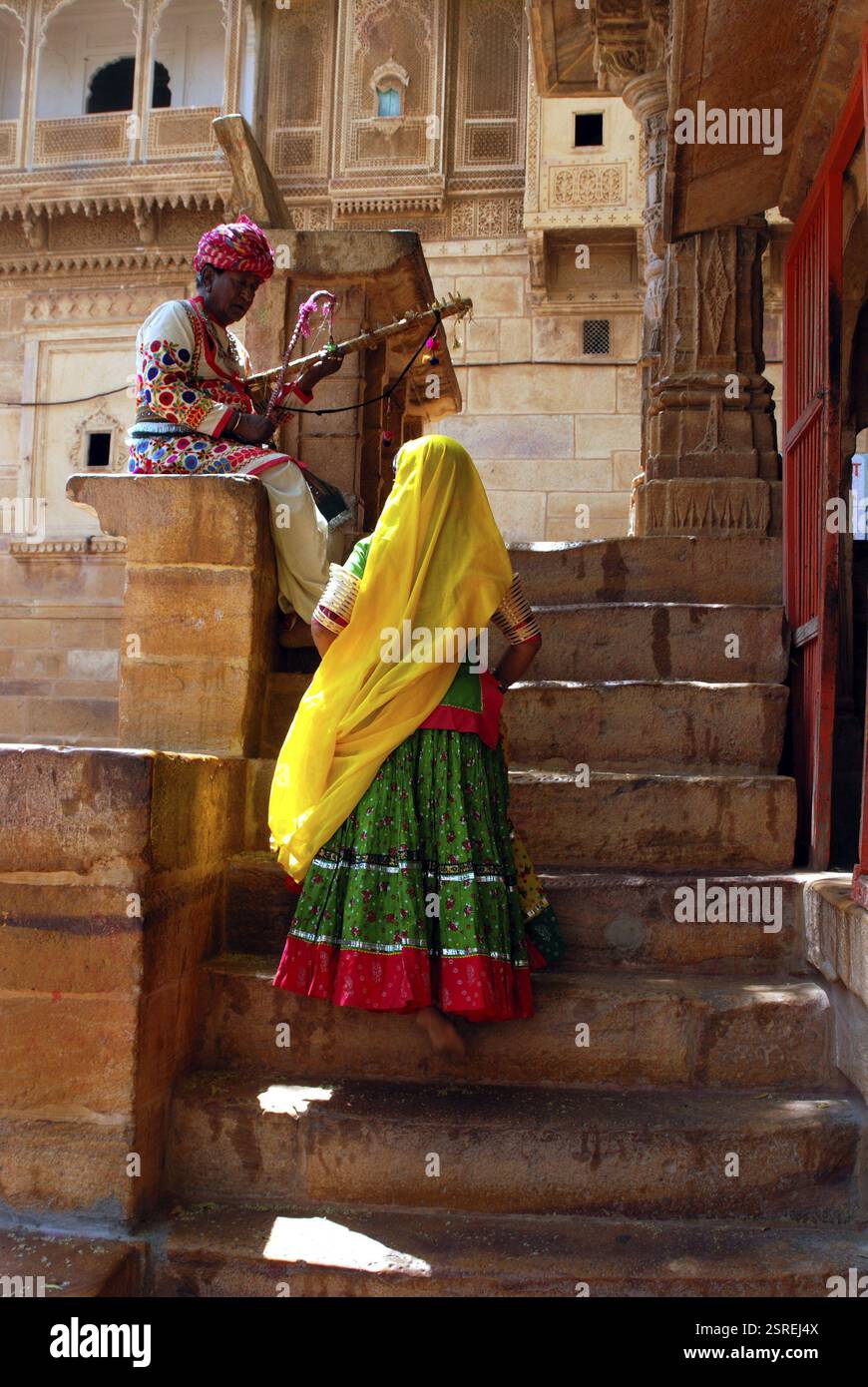 Rajasthani marwari lady listening ravanhatta played by folk musician ...